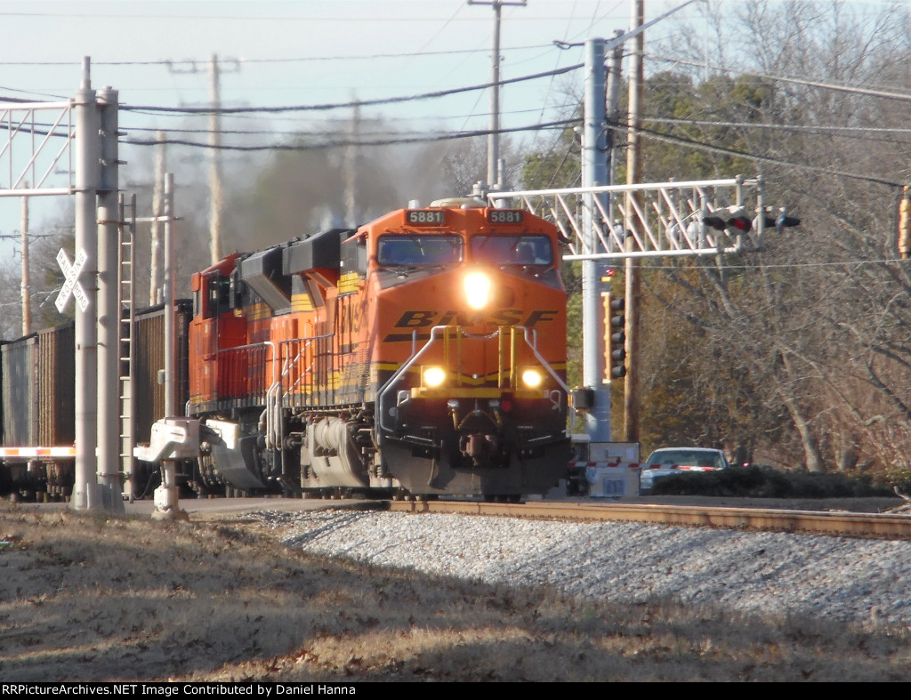 BNSF 5881 leads a heavy coal train by Milepost 536